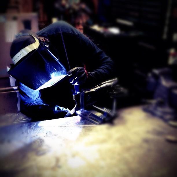 A welder’s hands and eyes