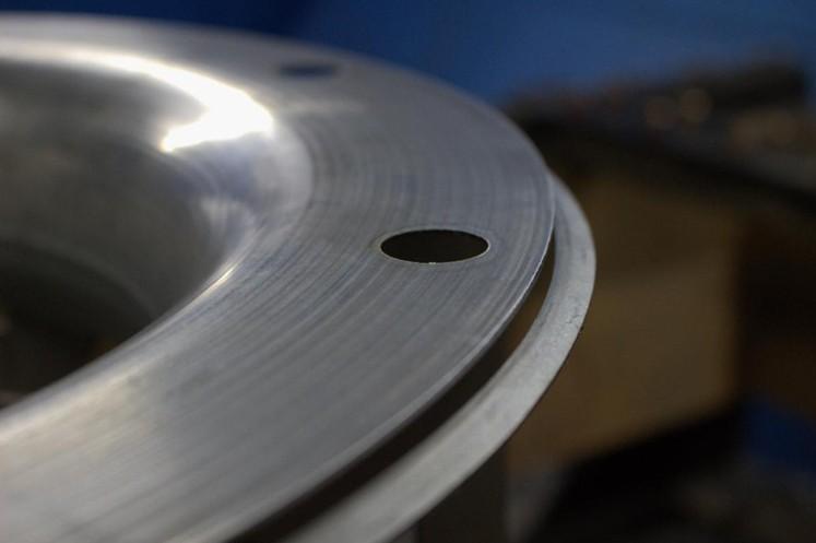 Five-axis laser transforms part finishing for metal spinning manufacturer